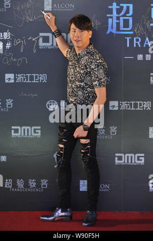 Taiwanese singer David Tao Zee, left, poses on the red carpet as he ...