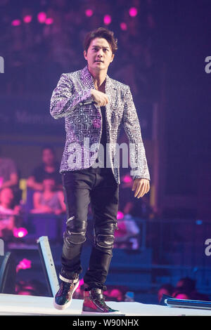 Taiwanese singer Kenji Wu performs during the "Daphne Extreme Live 2014 ...