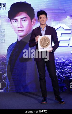 Taiwanese actor Nicky Wu poses on the red carpet for a celebrity event ...