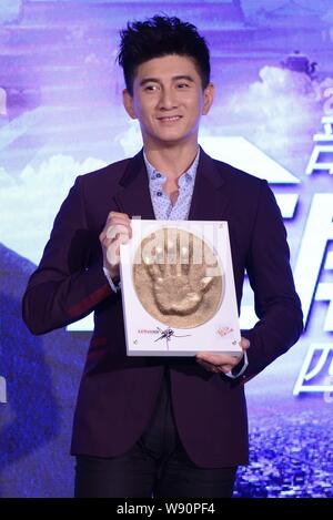 Taiwanese actor Nicky Wu poses on the red carpet for a celebrity event ...