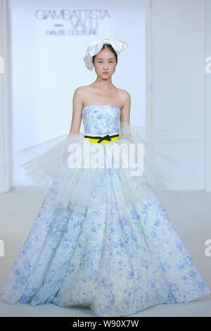 A model displays a new creation at the Giambattista Valli Haute Couture ...