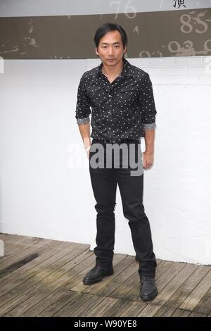 Stone (Shih Chin-hang) of Taiwanese band Mayday poses at a press conference to start filming of ...