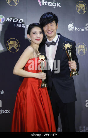 Malaysian singer Penny Tai, left, poses with her Taiwanese husband ...