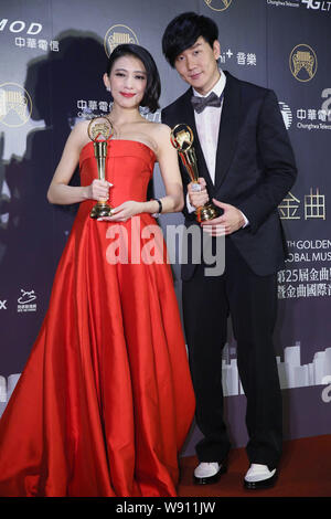 Malaysian singer Penny Tai, left, poses with her Taiwanese husband ...