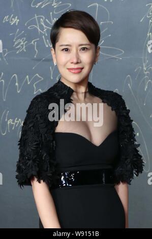 Chinese actress Hai Qing poses on the red carpet for The Esquire Man at ...