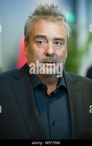 French director Luc Besson is interviewed during the Beijing premiere ...