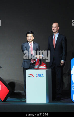 NBA Commissioner Adam Silver, right, shakes hands with Ding Zhizhong ...