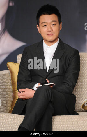 Chinese actor Tong Dawei poses on the red carpet as he arrives for the ...