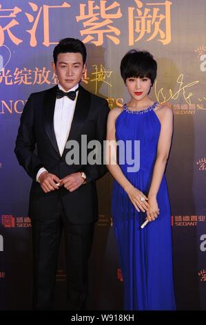 Chinese actor Lu Yi, left, and his actress wife Bao Lei attend the ...