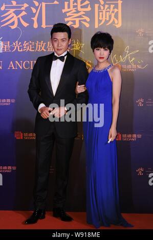 Chinese actor Lu Yi, left, and his actress wife Bao Lei attend the ...