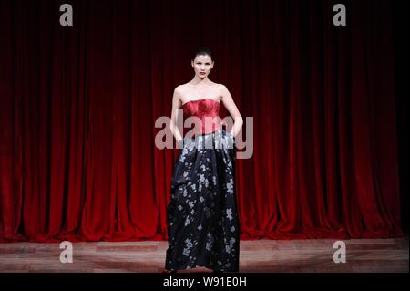 Chinese model Mo Wandan displays a new creation by Hong Kong designer ...