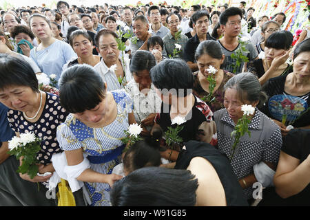 Family members of Chinese students Liu Yipeng, Wang Linjia and Ye Mengyuan, who died in the ...