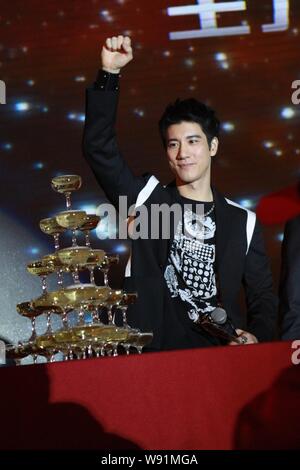 Taiwanese singer Leehom Wang waves during the 50th Anniversary of World ...