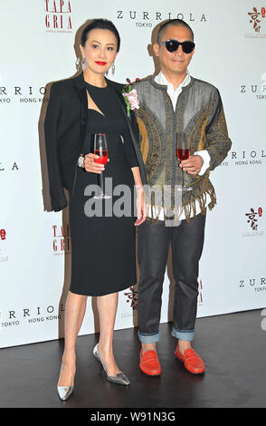 Chinese actor Tony Leung and his wife Carina Lau walk the red carpet ...