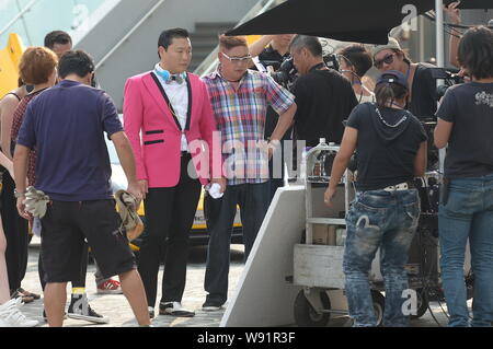 South Korean rapper Psy, left, talks with Hong Kong director Chin Kwok ...