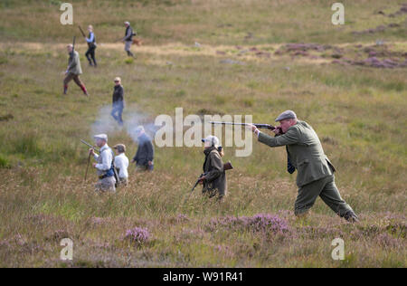 Robin Leslie-Melville, a member of a shooting party on the moors at the ...