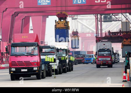 FILE - Shipping containers are loaded onto trucks at CSX Intermodal ...