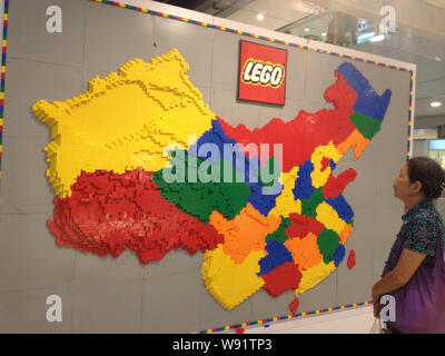 --FILE--A visitor looks at a map of China made by Lego bricks at the ...