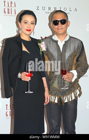 Chinese actor Tony Leung and his wife Carina Lau walk the red carpet ...