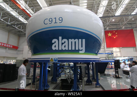 Chinese engineers examine the testing platform for Chinas C919 jumbo ...