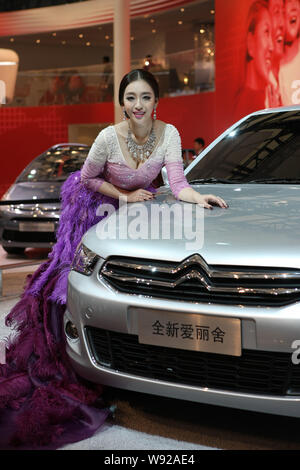 Chinese model Cao Yang poses with a Citroen Elysee during the 15th ...