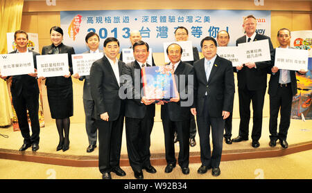 Liu Ming-hsiung (2nd left front), president of Amway Taiwan, poses with ...