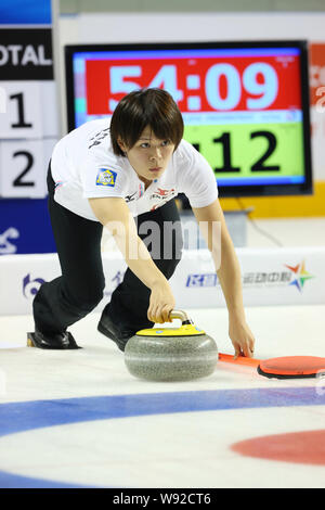 Kaho Onodera of Japan releases a stone in the womens fifth round match ...