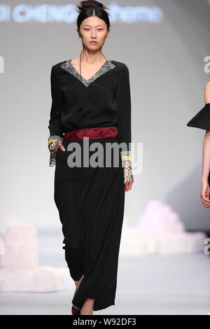 A model displays a new creation by female Chinese designer Ji Cheng at ...