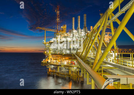 Onshore oil and gas processing plant showing pipework with oil ...