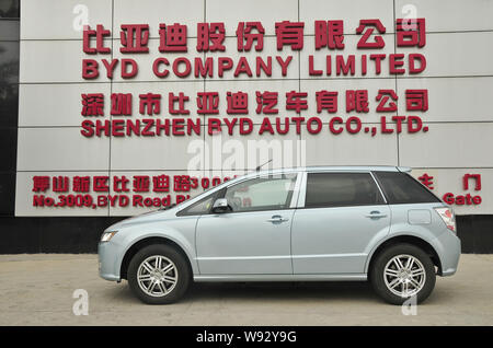 --FILE--A BYD e6 electric car is displayed in the showroom at the ...