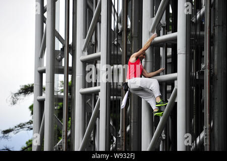 French climber Jean-Michel Casanova poses for photos after climbing up ...