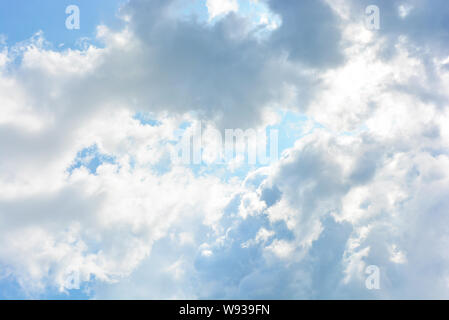Colorful heavenly angelic white clouds and blue, blue sky with sunlight ...