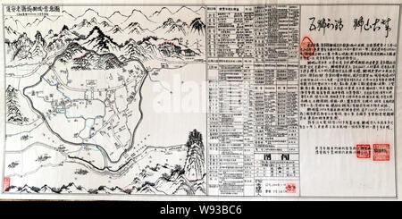 Chinese amateur cartographer Yu Nianchun poses next to his reference ...