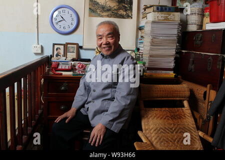Chinese amateur cartographer Yu Nianchun poses next to his reference ...
