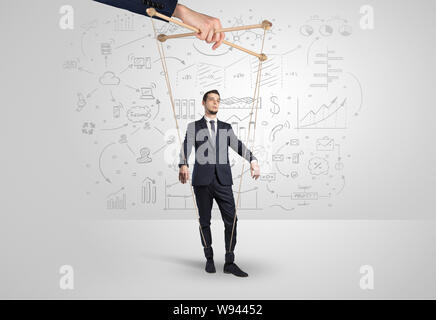 Little businessman controlled from above like a puppet concept Stock ...