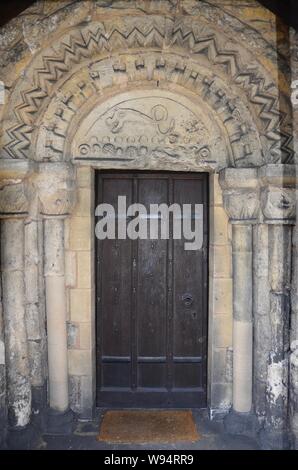 11th century stone carvings above the door of St. Helen’s Church ...