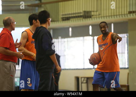 Gilbert Arenas of the Shanghai Sharks speaks during a training session ...
