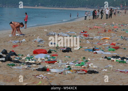 Garbage on a beach left by tourists, environmental pollution concept ...