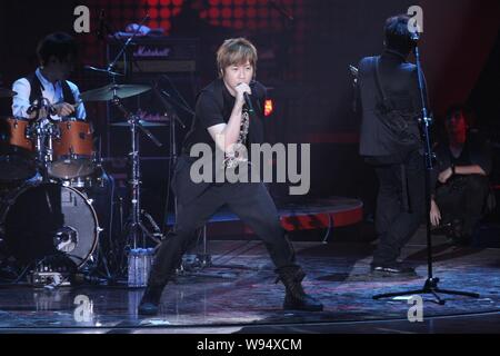 Chen Hsin-hung, center, better known by his stage name Ashin, and other ...
