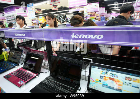 --FILE--Customers shop for laptop computers at a Media Markt store in ...