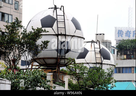 Football-shaped water tanks supplying tap water are pictured on the ...