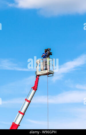 Cameraman in a camera platform on top of a BBC Television Outside ...