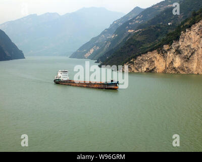 A cargo ship sails in the Xiling Gorge of the Three Gorges of the ...