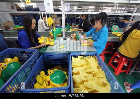 --FILE--Female Chinese workers make toys at a factory of Mattel Yunnan ...