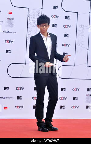 Chinese singer Hu Xia poses during a media event promoting his new ...