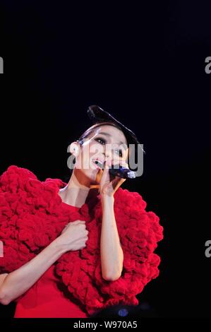 Taiwanese singer Fan Fan performs during her concert in Guangzhou ...