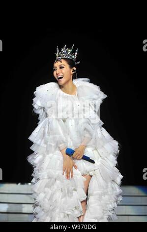 Taiwanese singer Fan Fan performs during her concert in Guangzhou ...