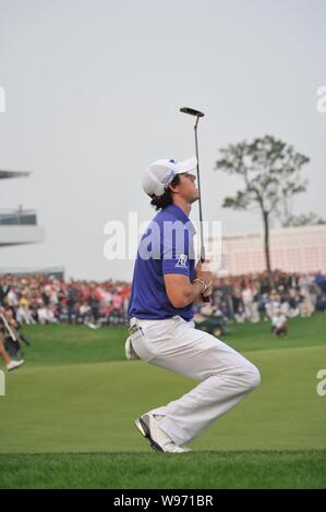 Rory McIlroy, of Northern Ireland, reacts after putting on the 18th ...