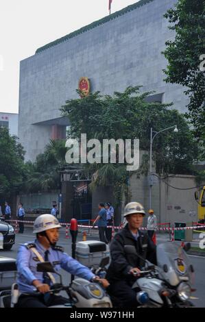 Wang Lijun, former Director of Chongqing Public Security Bureau, stands ...