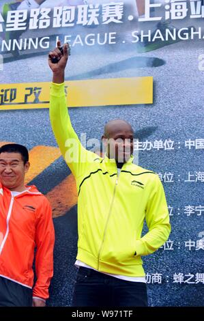 Jamaican sprinter Asafa Powell fires the starting gun for a race in ...